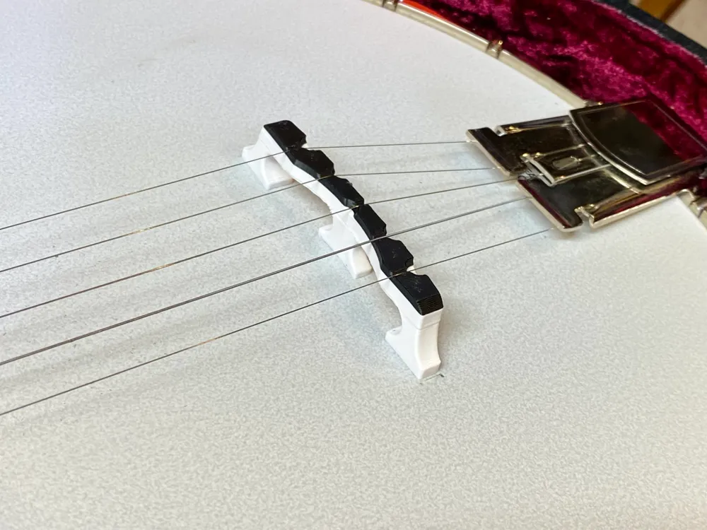 Compensated Banjo Bridge by Jim LarsenMakerWorld: Download Free 3D Models