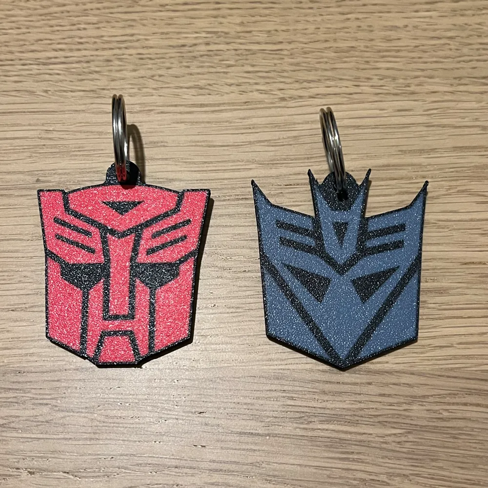Transformers keychain (Autobot vs Decepticon) by 3Dingo - MakerWorld