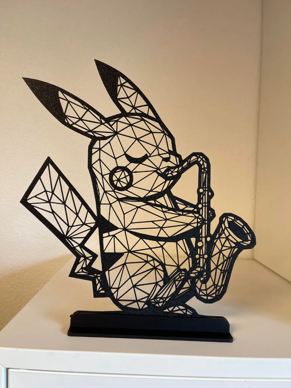 Pikachu from pokemon playing sax by The Line Art Girl