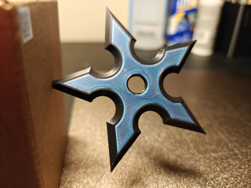 Multi-Colored Ninja Throwing Star - Free 3D Print Model - MakerWorld