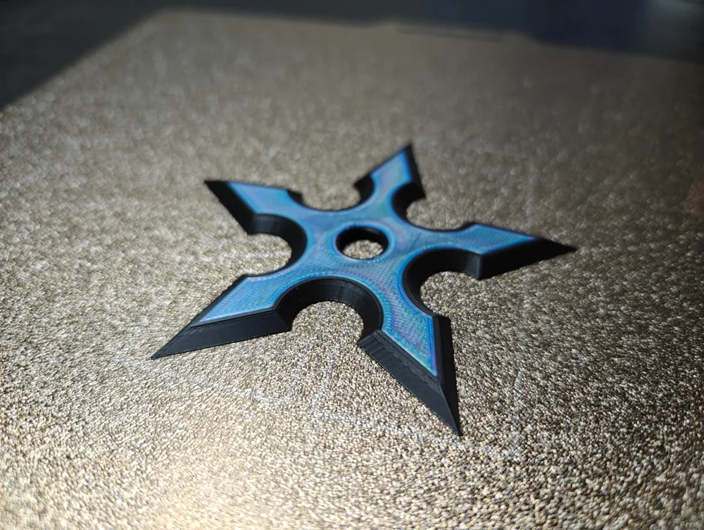 Multi-Colored Ninja Throwing Star - Free 3D Print Model - MakerWorld